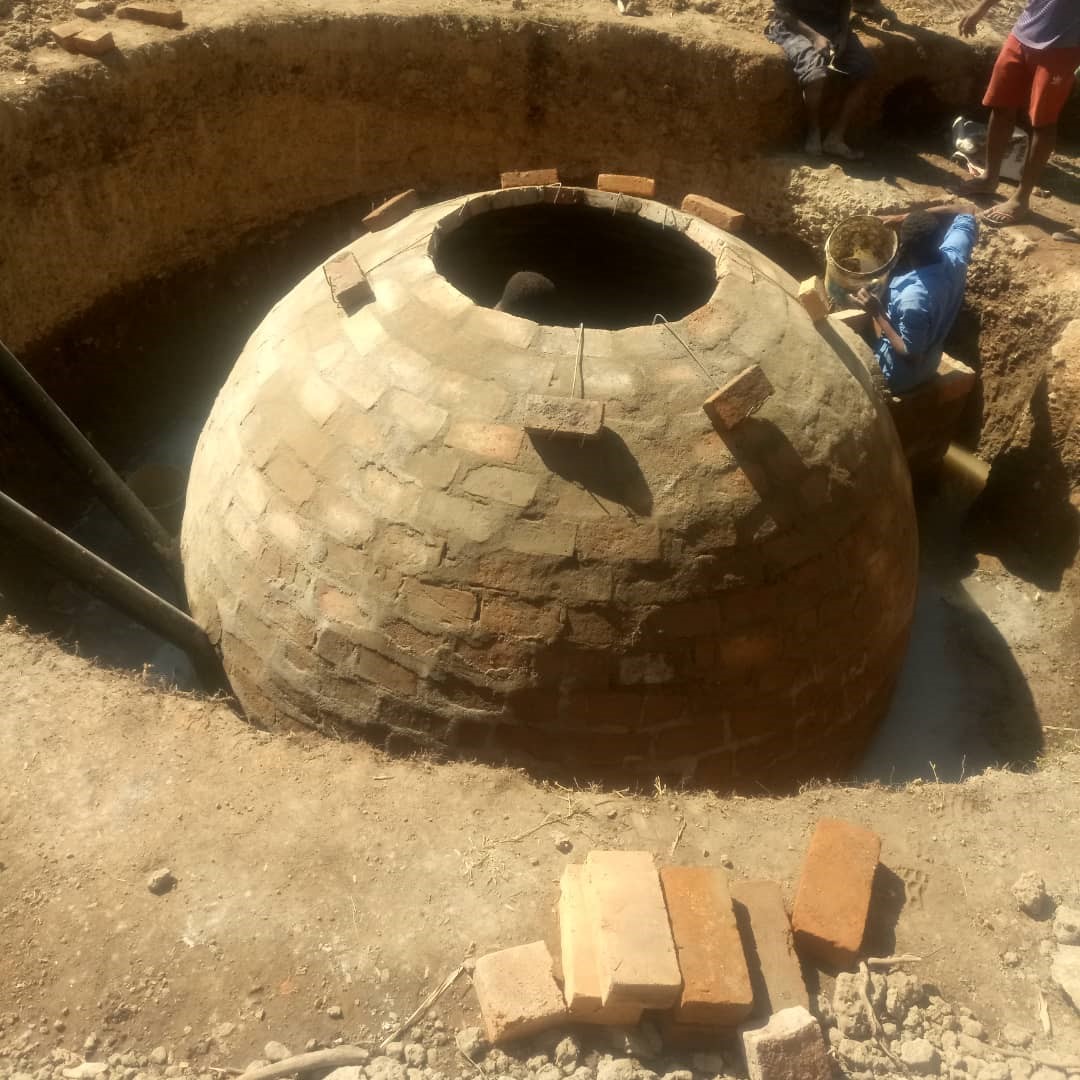 ATC staff train student on how to build a biodigester following ...